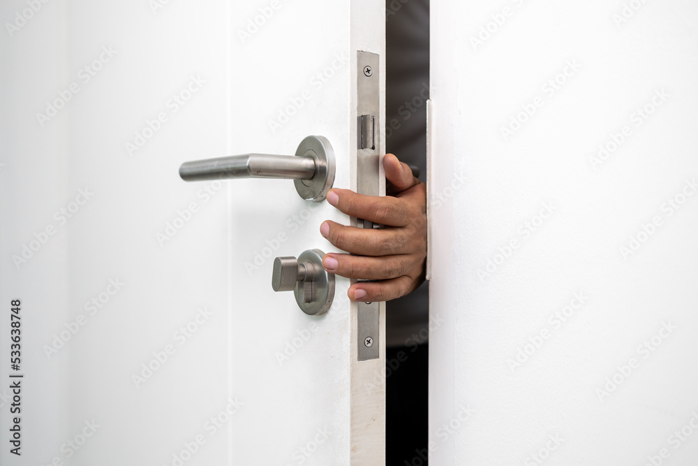 Hand clamped door. A young man shut the door of the house so carelessly ...