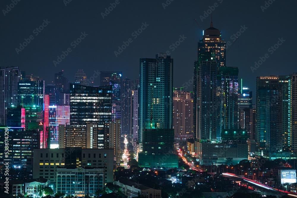 Night city view of business district with skyscrapers in Manila ...