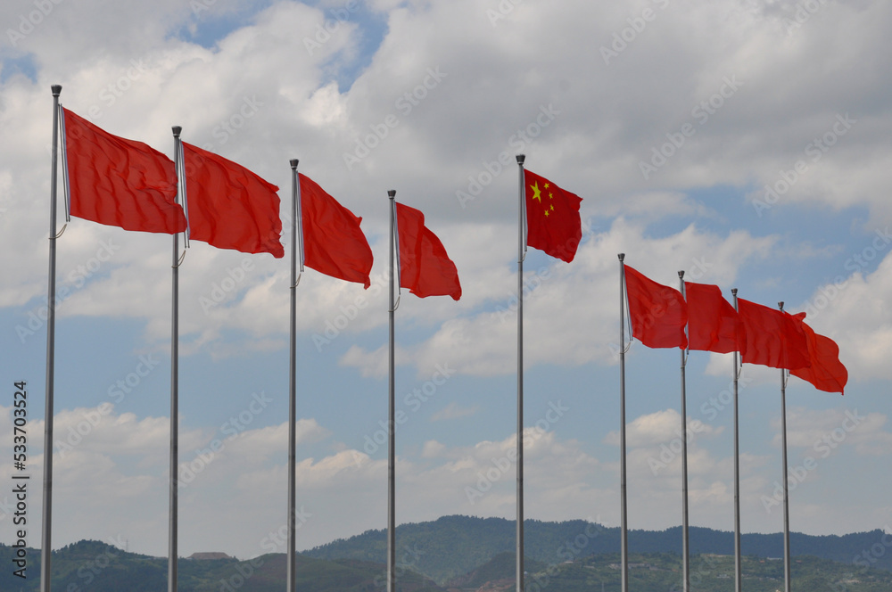 row of red chinese flags in nature Stock Photo | Adobe Stock
