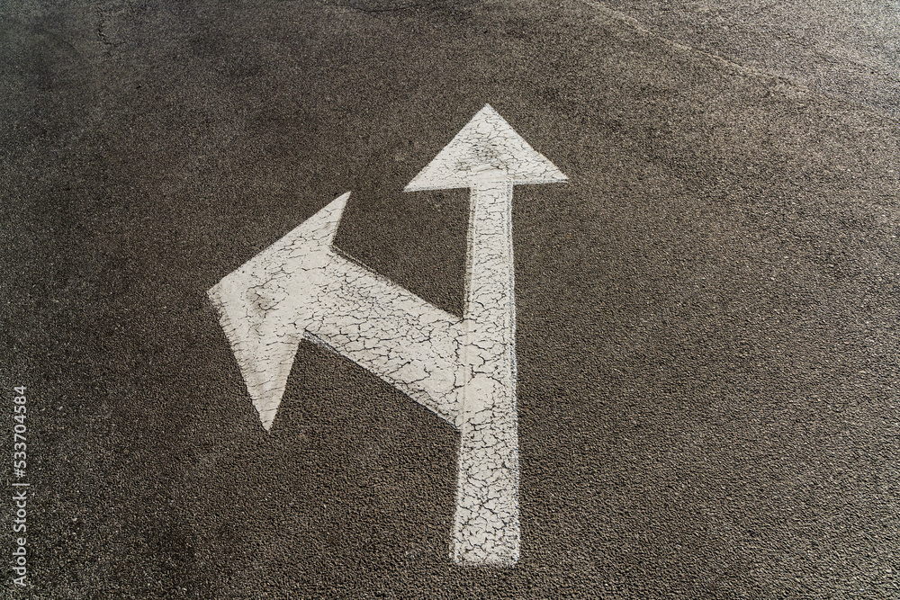 Road marking with two arrows drawn on asphalt Stock Photo | Adobe Stock
