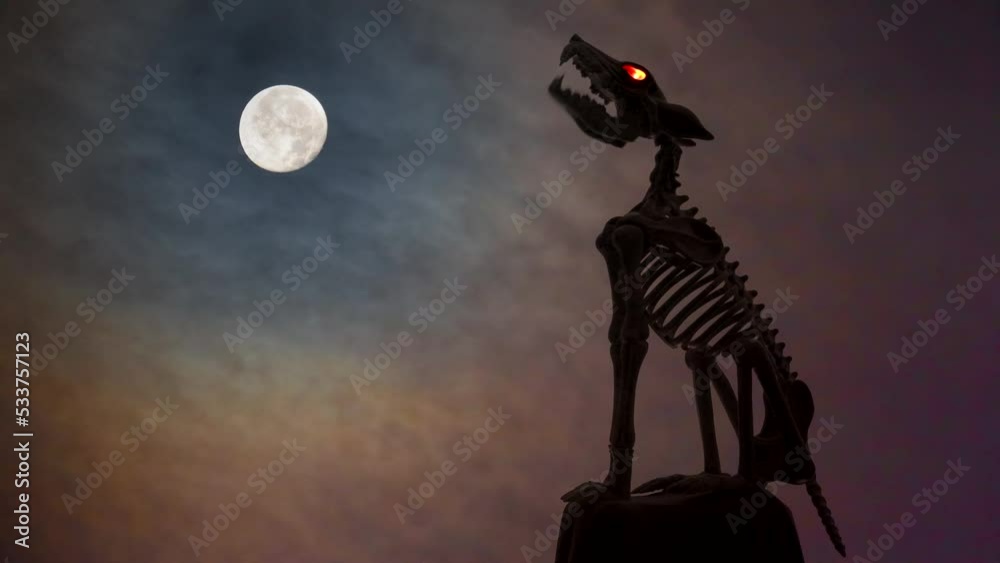 Halloween skeleton hellhound howling at the moon with red glowing eyes ...