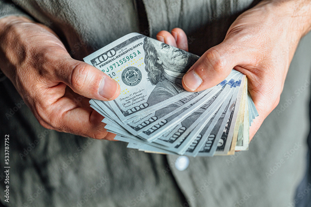 hand holding 100 dollar bank notes detail for business and financial ...