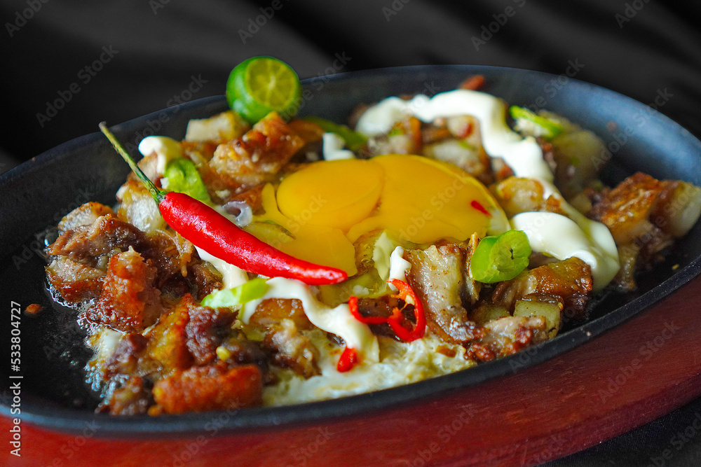 sizzling pork sisig Stock Photo | Adobe Stock