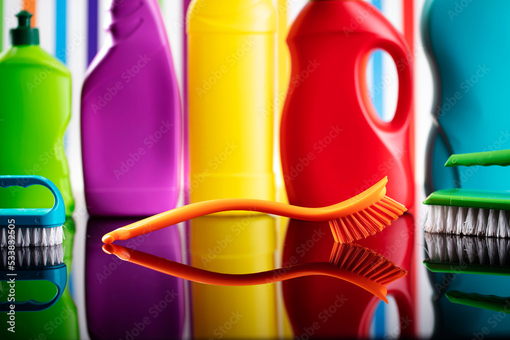 House and office cleaning theme. Colorful cleaning kit on background in ...