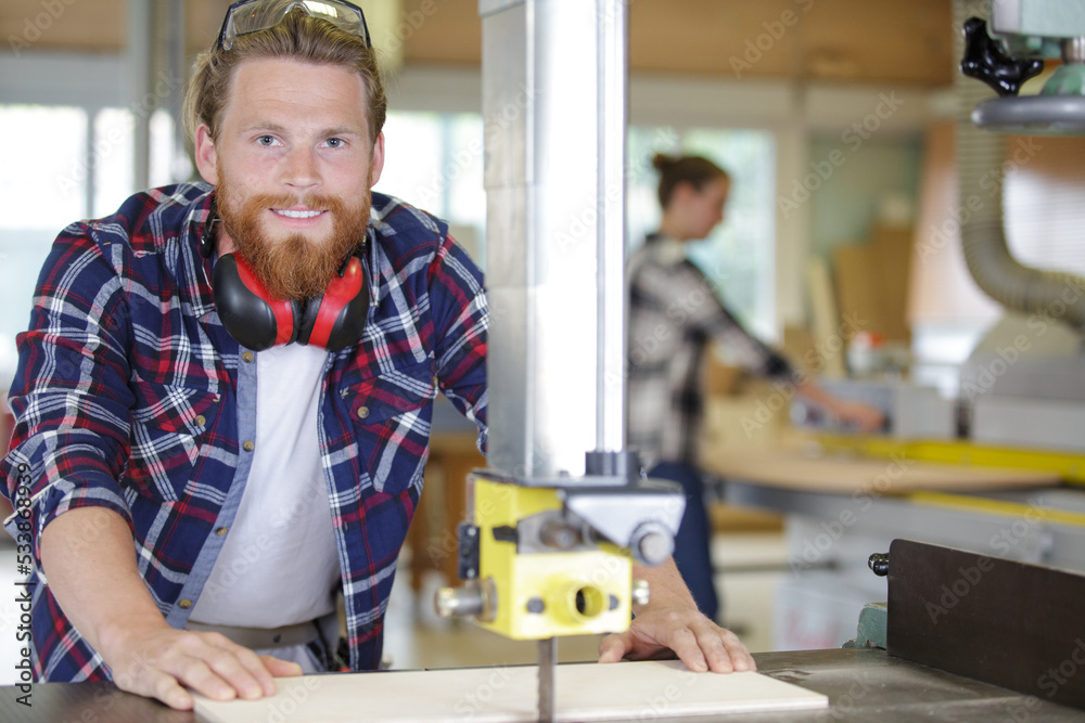 man with a mill works in safety Stock Photo | Adobe Stock