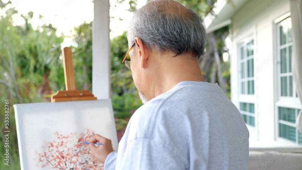 Senior painting picture, old man drawing in garden. Senior holding ...