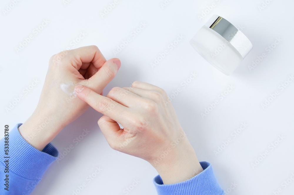 Hand cream on the finger of caucasian woman. View from above. White ...