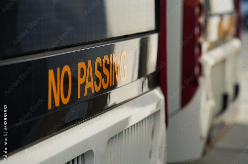 No passing traffic sign on an airport, behing the bus passenger ...