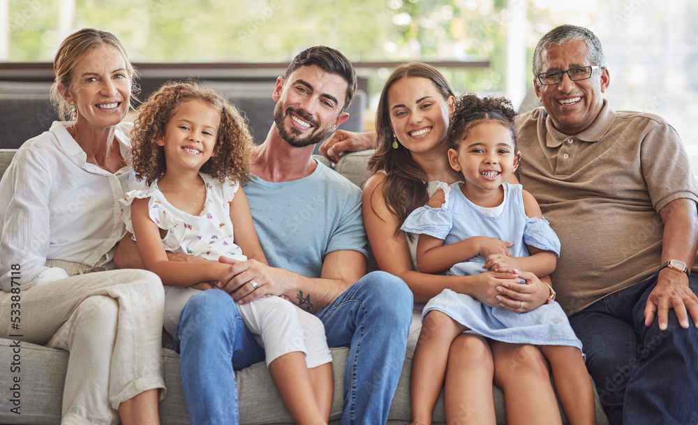 Interracial family, happy portrait and parents on the living room sofa with children, relax in ...