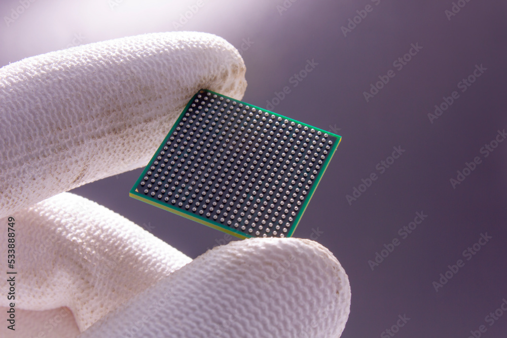 Semiconductor BGA chip in a hand on a gray background Stock Photo ...