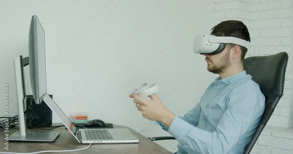 Young architect engineer wearing augmented reality glasses uses ...