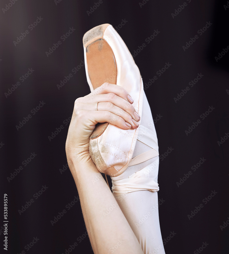 Dancer hand and foot on ballet shoe and hand, show posture and balance ...