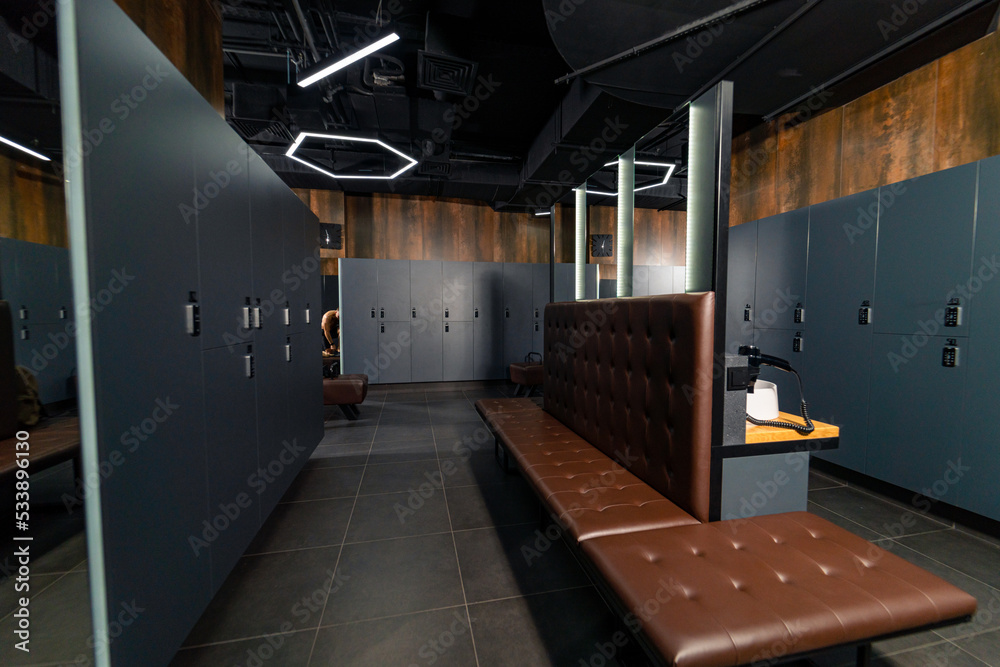 Empty dark changing room. Sport club locker room. Stock Photo | Adobe Stock