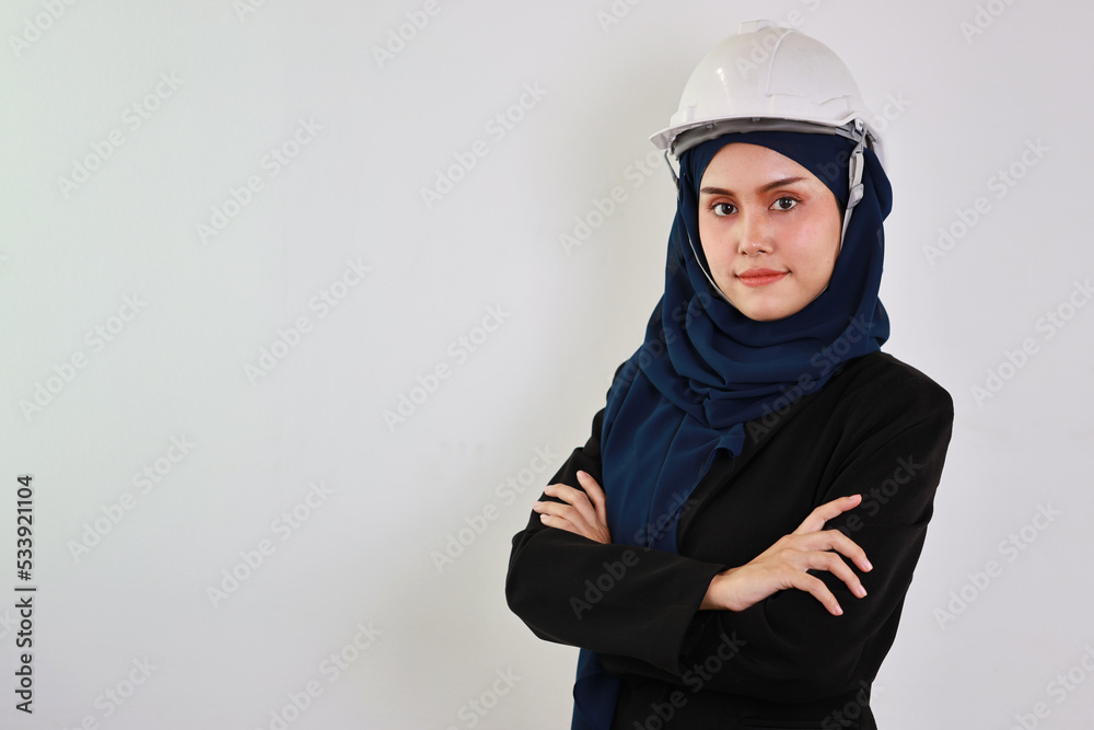 Happy and smart muslim asian engineer standing and arms cross with ...