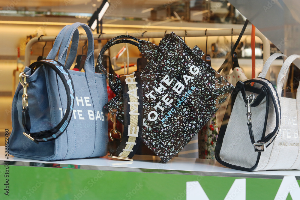 TOKYO, JAPAN - April 30, 2021: Bags in the window of a Marc Jacobs ...