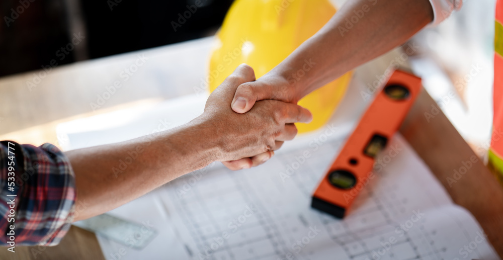 Contructor and Customer home buyer handshake for success construction ...