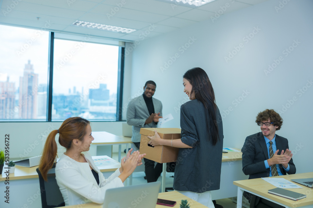 New colleague is coming into the office. Asian woman coming to the ...