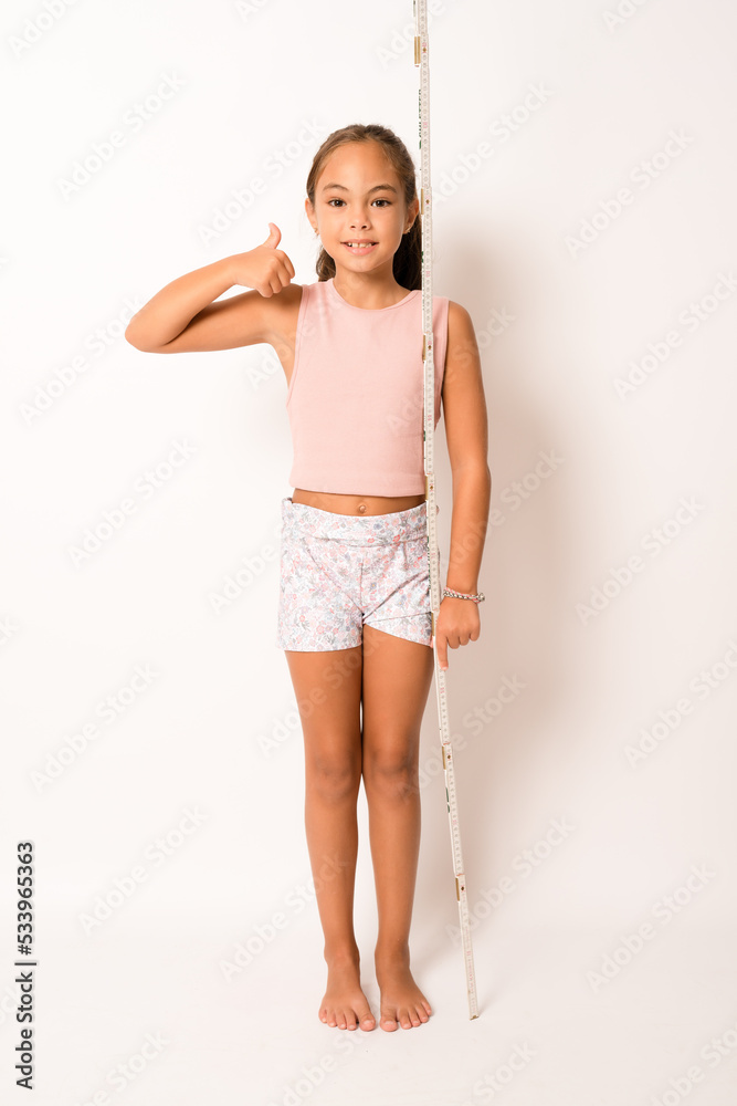 little girl with measuring tape isolated in white background. Stock ...