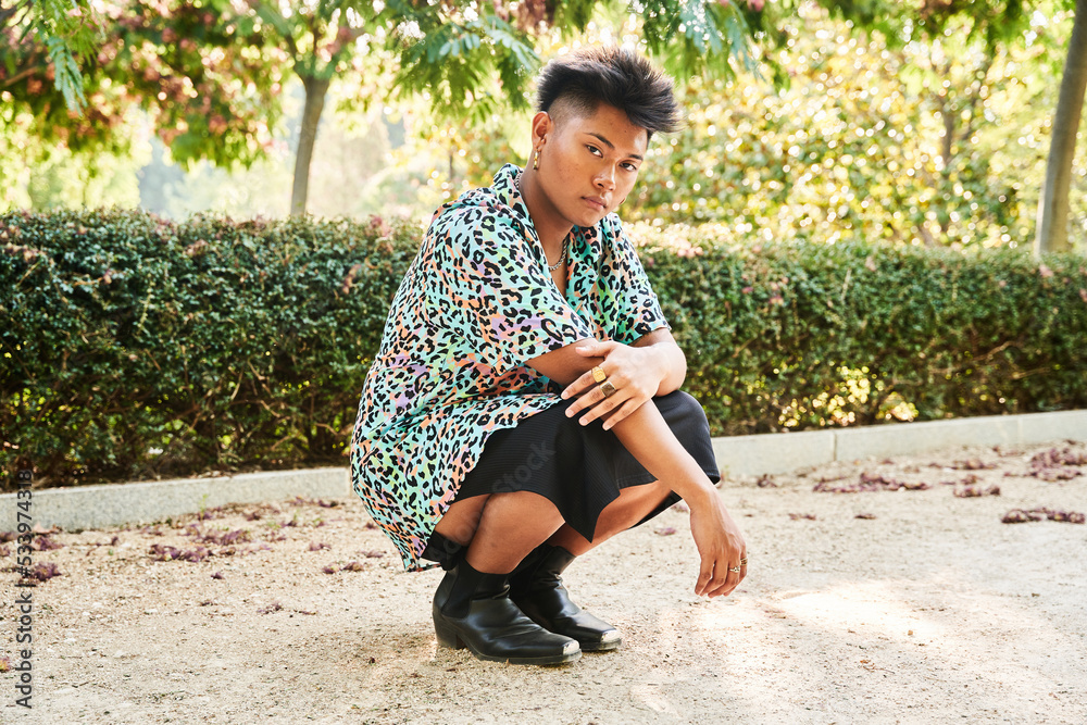 Stylish Filipino transgender woman sitting on haunches Stock Photo ...