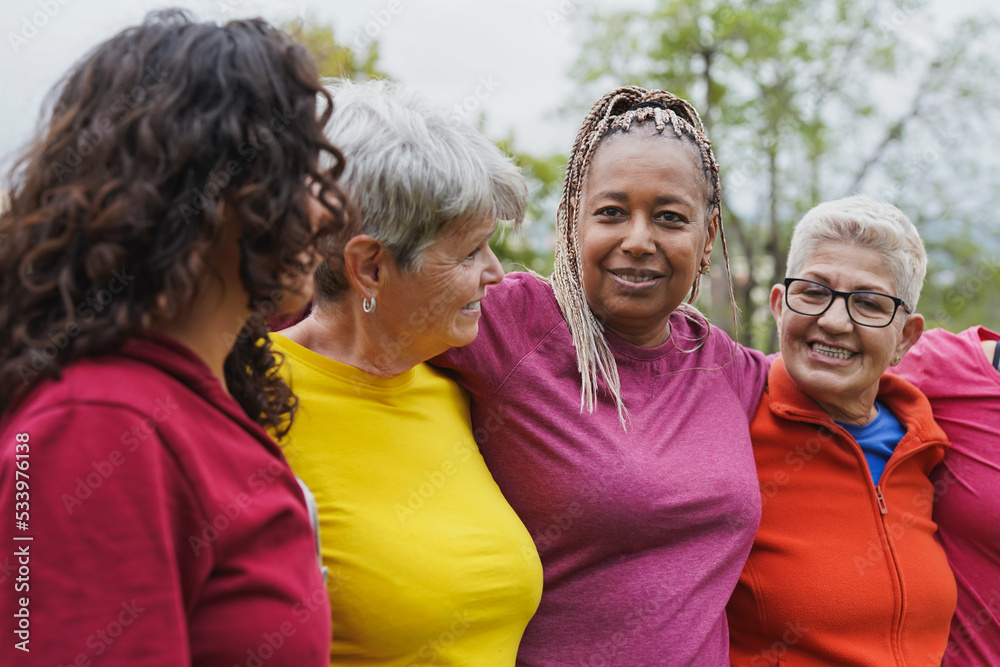 Multi generational women hugging each other at city park - Multiracial ...