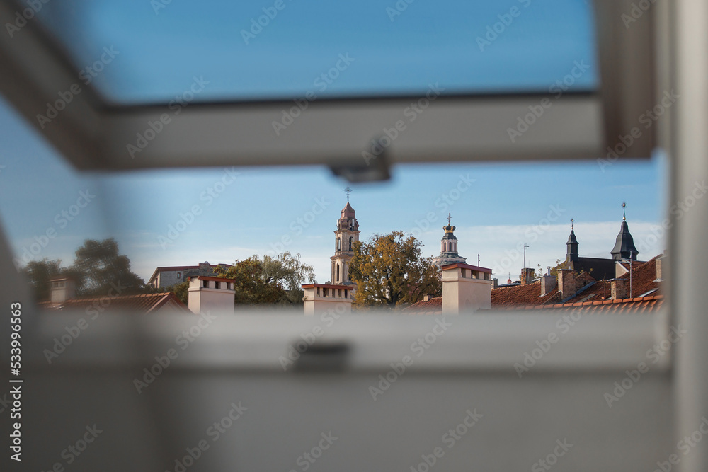 Skylight on a sloping roof with a movable frame for ventilation and ...