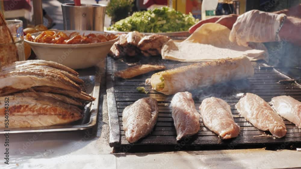 Grilled fish diner kebab in Istanbul. Balyk sandwich street food in ...