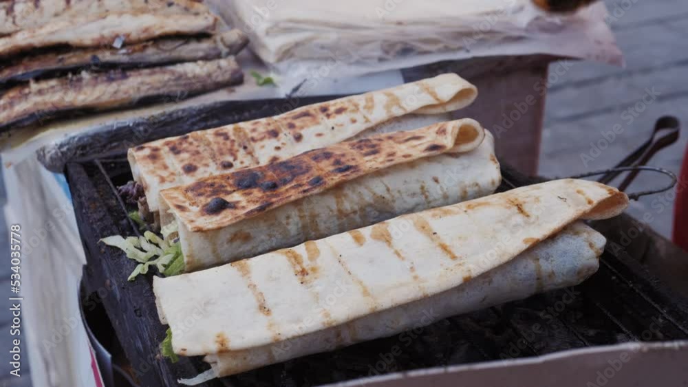 Grilled fish diner kebab in Istanbul. Balyk sandwich street food in ...