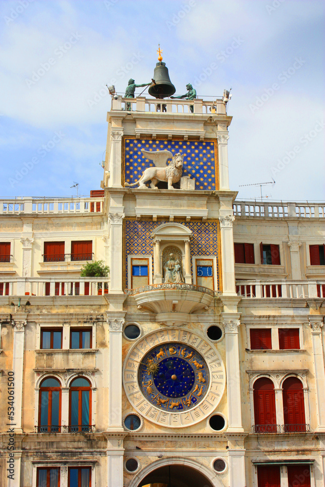 Zodiac clock. Clock Tower with winged lion and two moors striking the ...