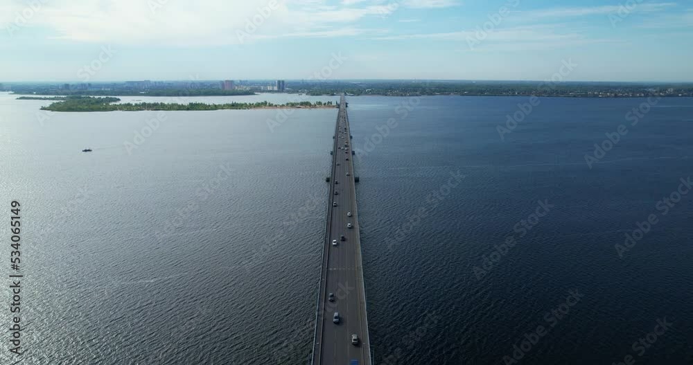 A long road bridge over the river. Traffic on the bridge, Aerial view ...