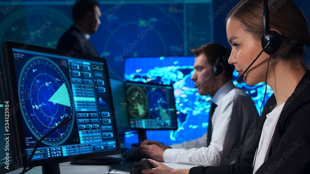 Workplace of the air traffic controllers in the control tower. Team of ...