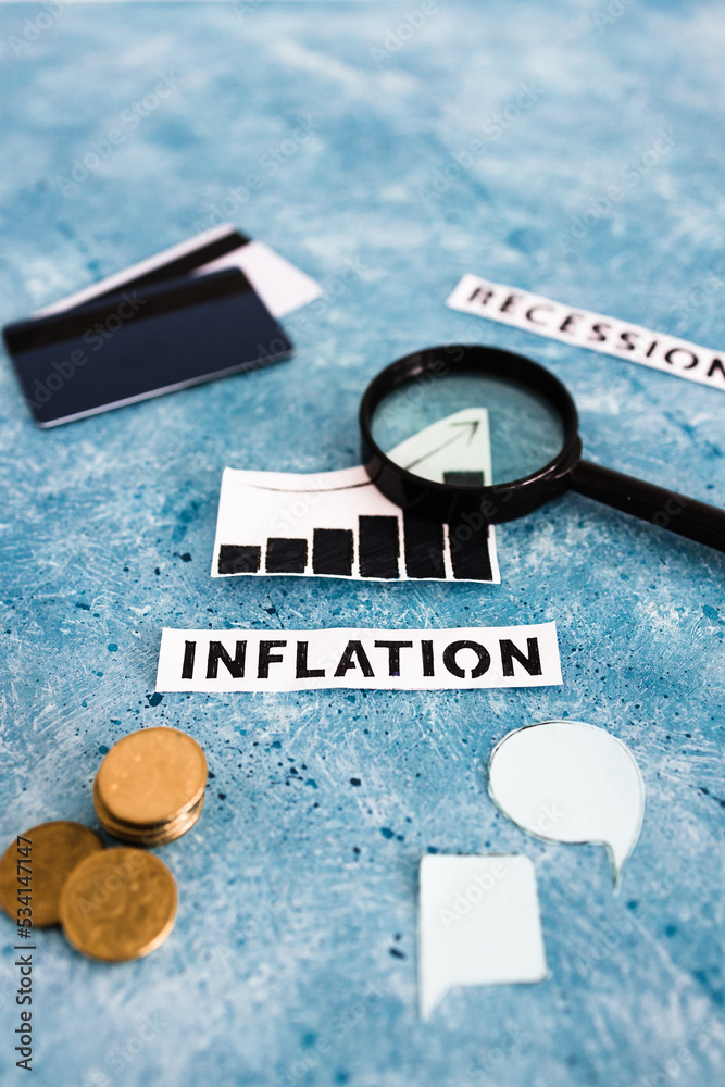 inflation text and graph showing prices going up with magnifying glass ...
