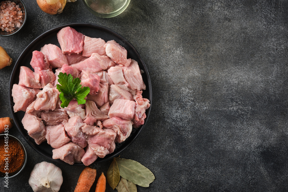Raw Diced pork meat - ready for cooking. Chopped pork meat with ...