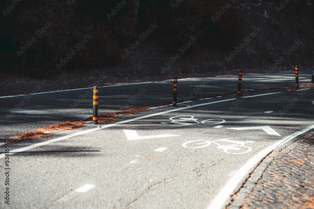 View with a shallow depth of field of a modern suburban road in a park ...