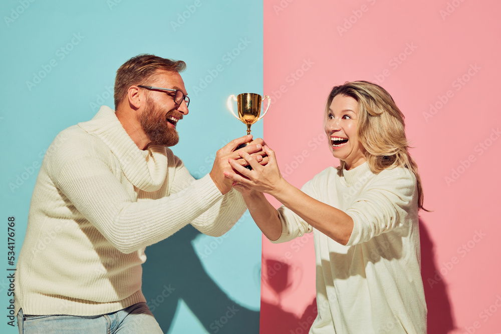 Winner emotions. Excited young people, man and woman, husband and wife ...