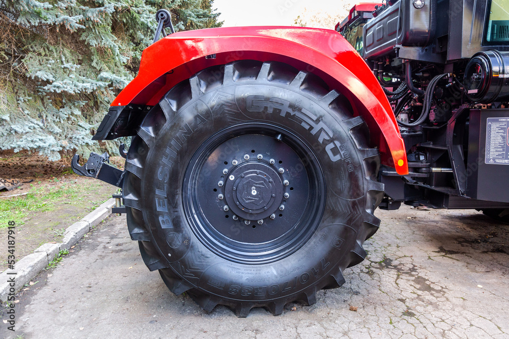 Wheel of new modern agricultural wheeled tractor. Belshina tyres Stock ...
