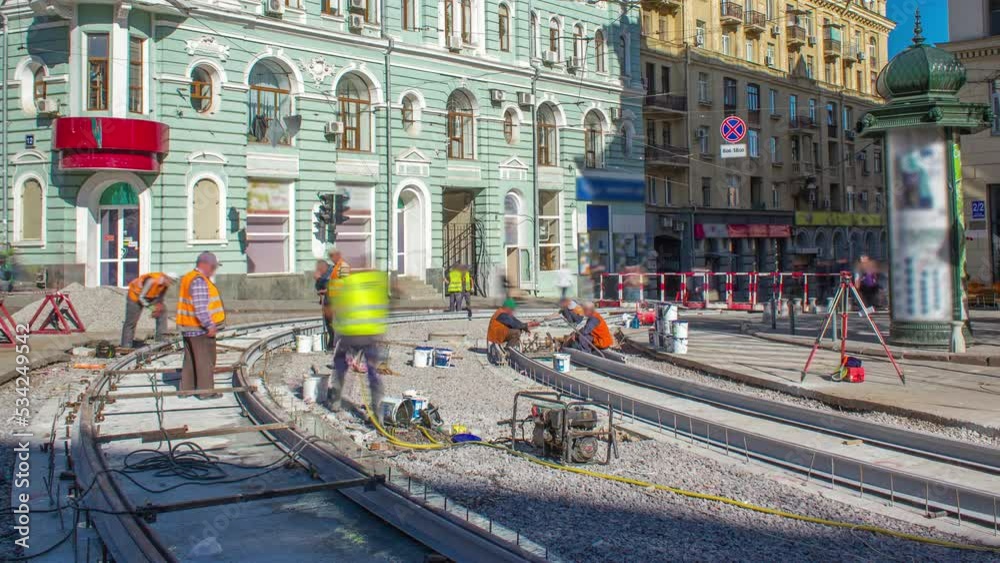 Repair works on the street timelapse. Laying of new tram rails on a ...