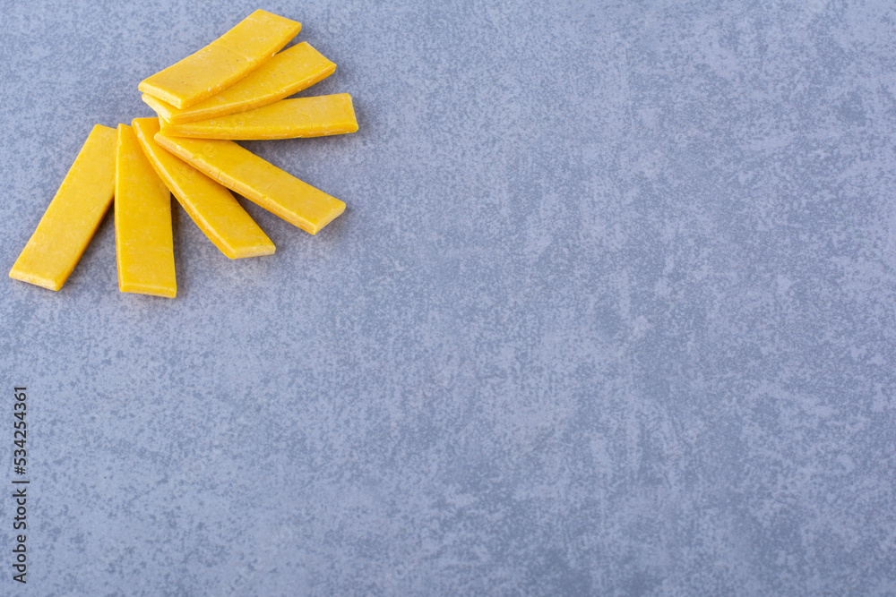 Stack of yellow chewing gum sticks on marble background Stock Photo ...