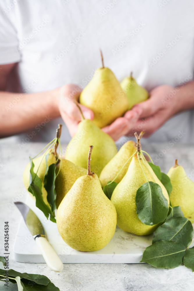 Pears. Fresh sweet organic pears with leaves on stand or plate and in ...