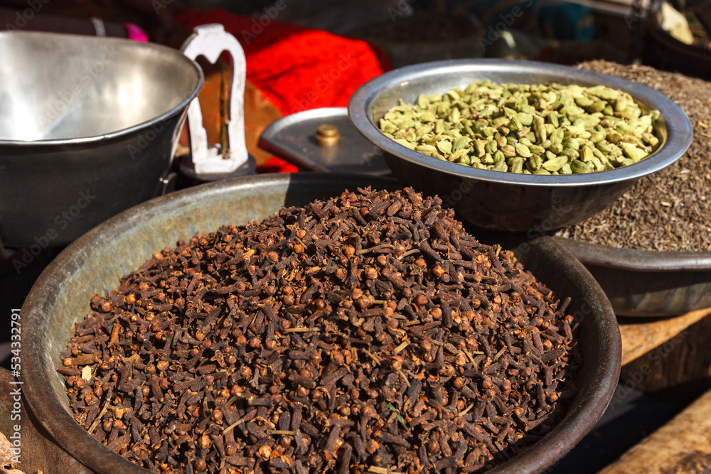 Cloves and cardamom for sale at the Indian market Stock Photo | Adobe Stock