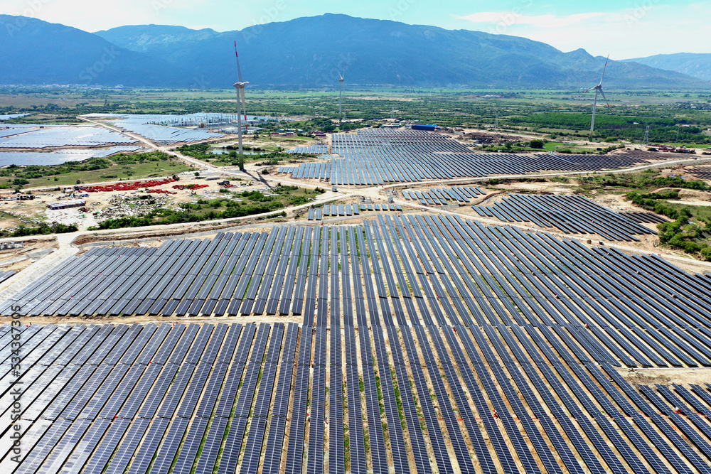 Solar panels and wind turbines generating alternative power and green ...