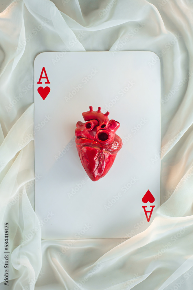 Ace of hearts, an anatomically correct heart in the center of a playing ...