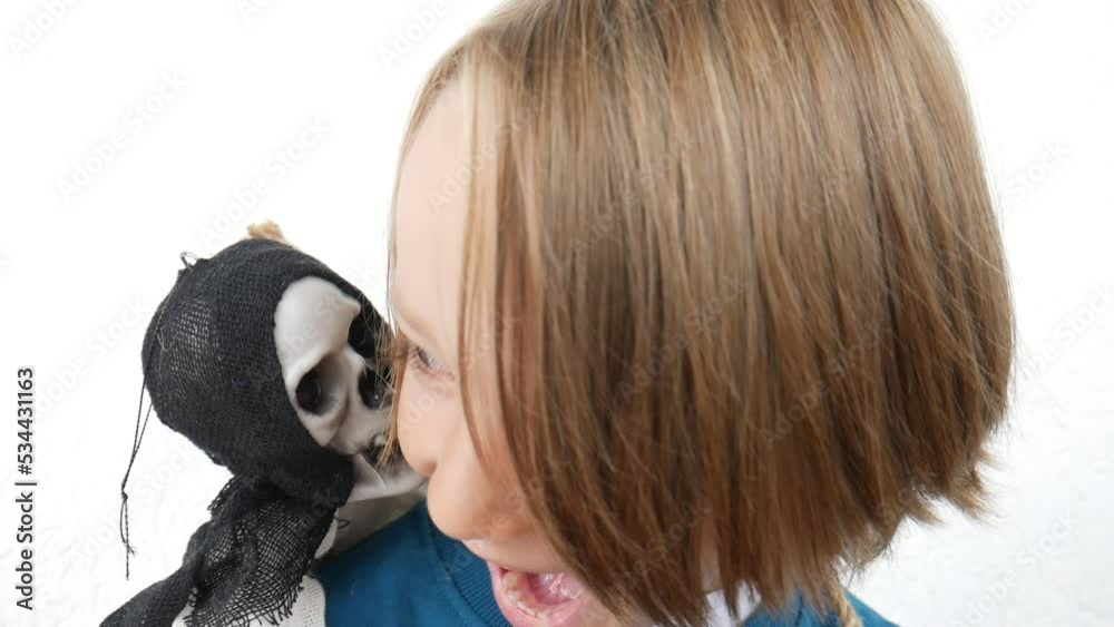 A boy turns his head to the side and suddenly sees a toy ghost on his ...