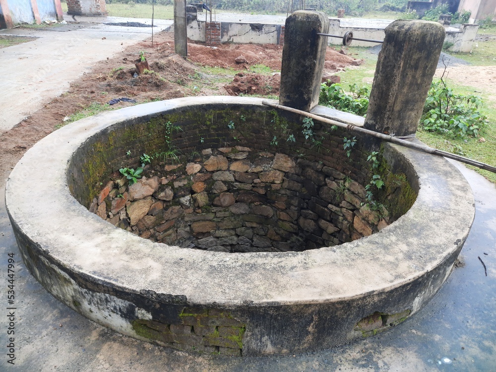 Old water well. It is common to see these wells in the fields of India ...