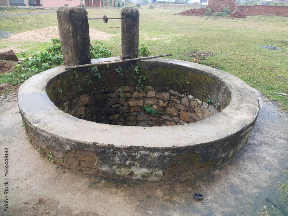 Old water well. It is common to see these wells in the fields of India ...