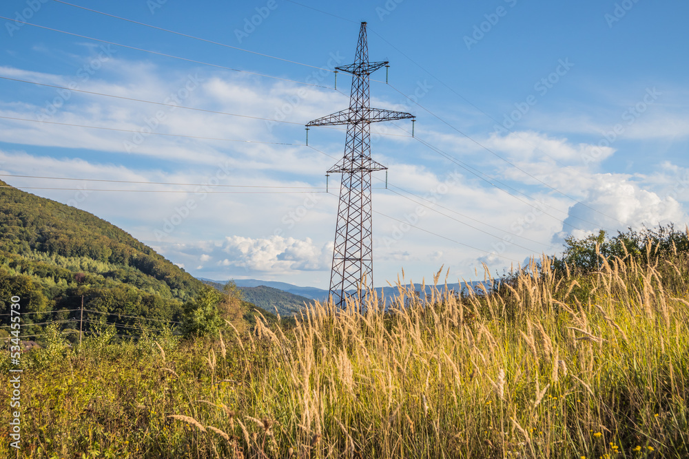 High voltage, power transmission line on the mountain range. Overhead ...