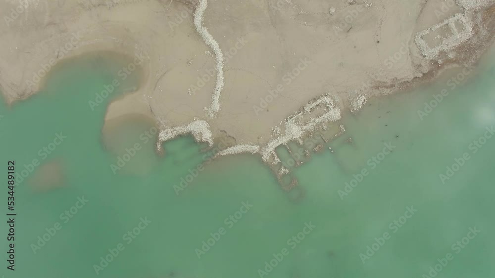 Overhead drone view and camera move pedestal down of the ruins ...