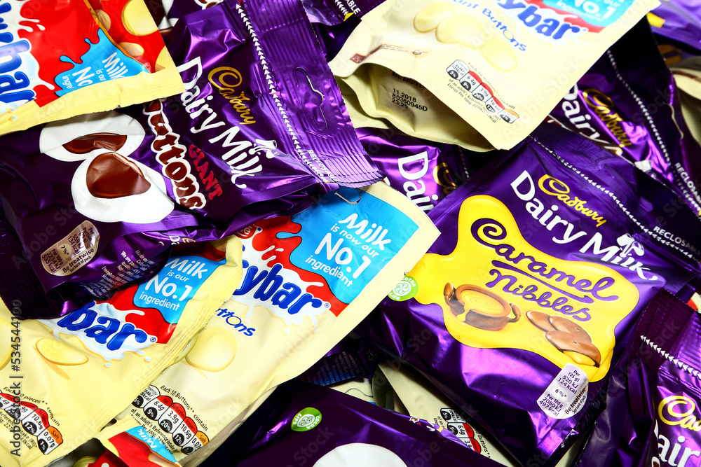 Packets of various chocholate snacks including cadbury twirl bites ...