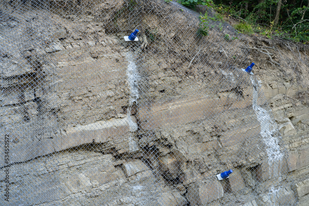 Reinforcing mountain slope with metal mesh and concrete reinforcement ...