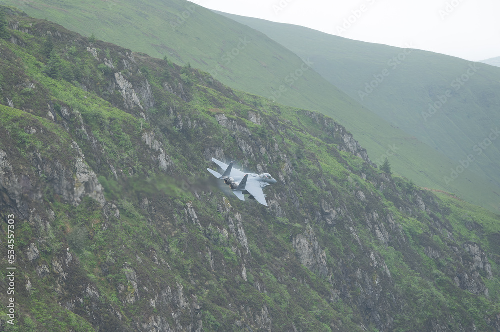 USAF F15 Eagle flying through Mach Loop in Wales at low level during ...