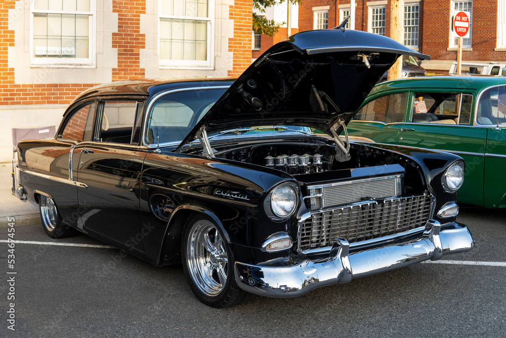 Black retro Chevrolet Bel Air with open car hood. 1955 Chevy at car ...